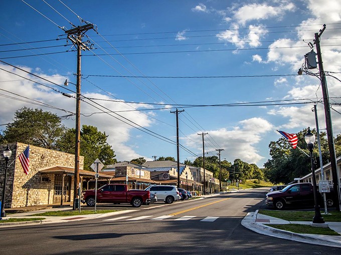 This peaceful street scene captures the essence of small-town Texas where neighbors still wave from their porches.