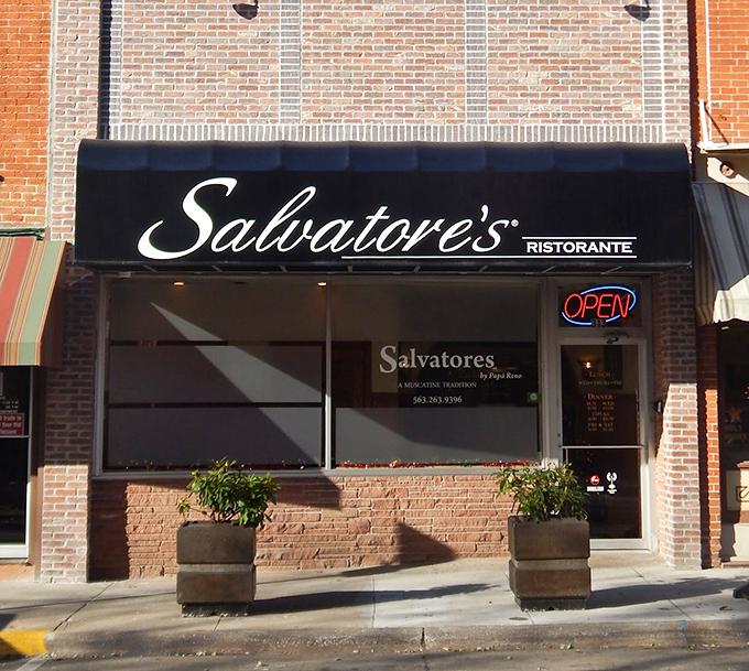 The simple "OPEN" sign at Salvatore's might be the best news you'll get all day. Authentic Italian awaits behind that unassuming facade.