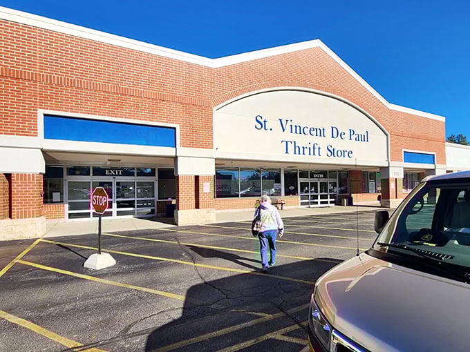 The stop sign seems to say "Halt! Bargains ahead!" as shoppers make their pilgrimage to St. Vincent's thrifting mecca.