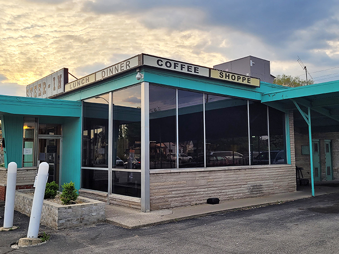 Morning light bathes Steer-In's classic diner exterior. The "Coffee Shoppe" sign promises the fuel you need to start your day right.