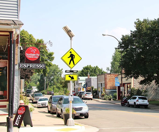 The Stockholm Pie Company sign hints at delicious treats in this affordable Mississippi River town. Sweet living that won't sugar-crash your budget!