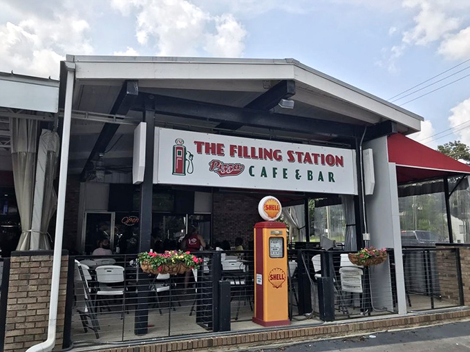 That vintage gas pump isn't pumping petroleum anymore, but the pizza inside will fuel your happiness for days.