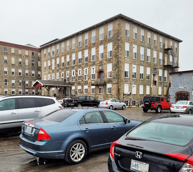 Rows of windows watch over the parking lot of The Old Mill, where history and bargain hunting beautifully collide.