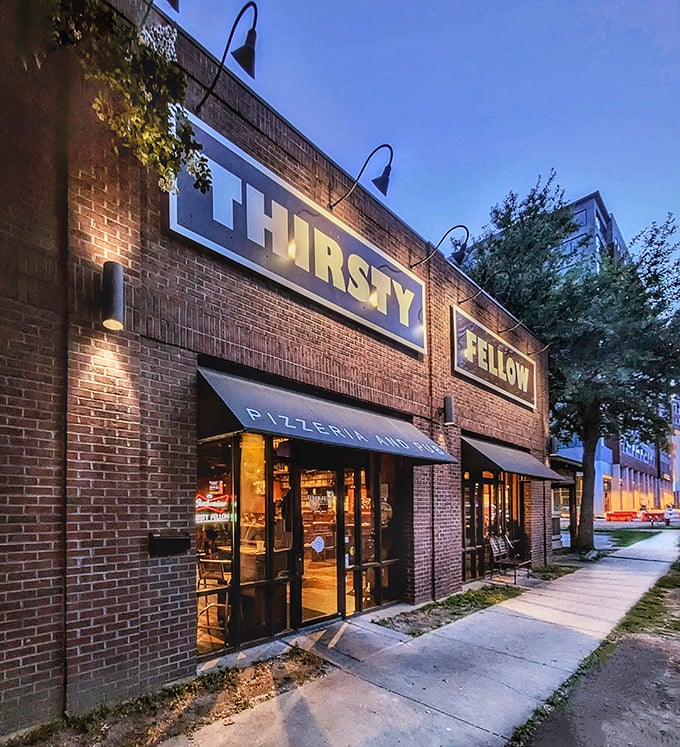 As night falls, Thirsty Fellow's warm glow invites you in for that perfect pizza-beer combination.