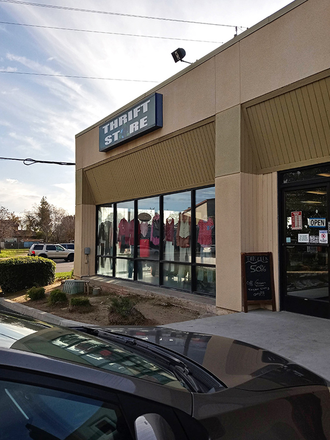 As the sun sets on Thrift City, the window displays offer a colorful preview of treasures waiting inside. Bargain hunting never looked so inviting!