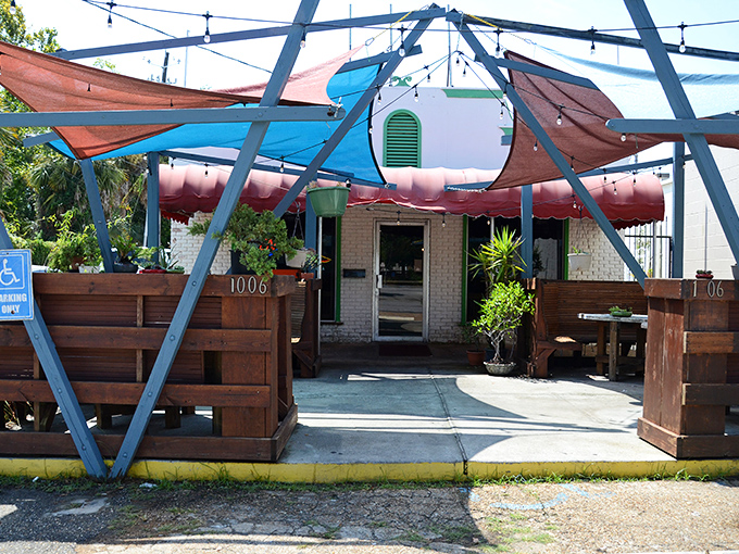 Those wooden booths at Tom's scream "Pizza fort for adults!" Come for the shade, stay for the slices.