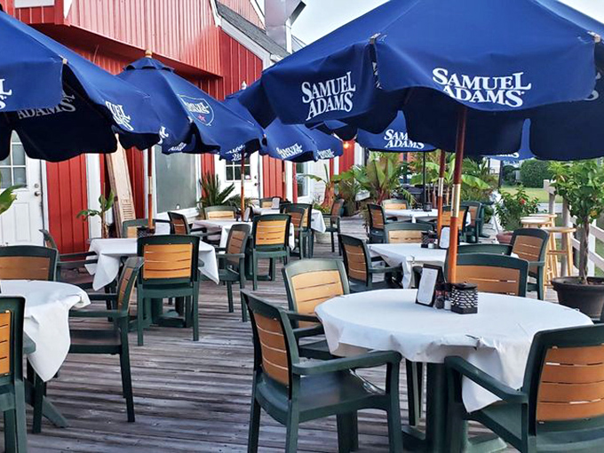 Blue umbrellas and deck seating prove that sometimes the best hot dogs taste even better with fresh air.