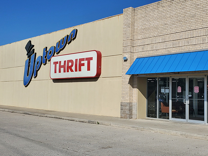 The thrift store equivalent of a wink and finger guns &ndash; Uptown's playful signage promises a blue-ribbon shopping experience under that Oklahoma sunshine.