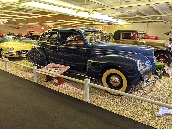 The stately 1939 Lincoln Zephyr stands as a testament to Art Deco on wheels, its streamlined silhouette whispering tales of Depression-era luxury.
