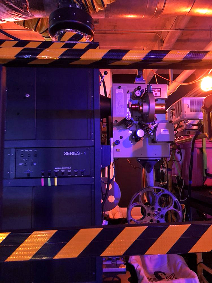 Behind the movie magic stands this beautiful 35mm projector, a mechanical time machine delivering stories frame by glorious frame.