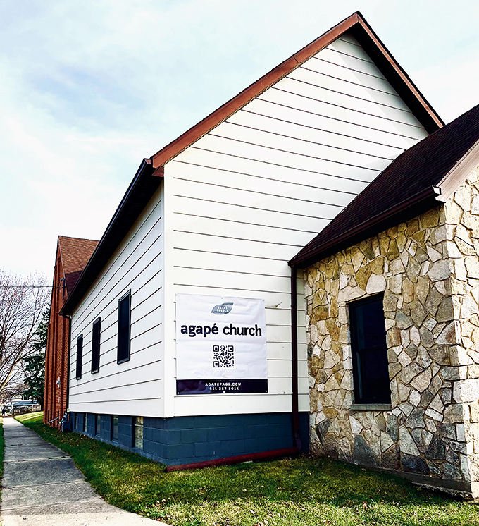 The Agapé Church stands as a testament to small-town spirituality, its stone facade weathered by prayers and prairie winds.