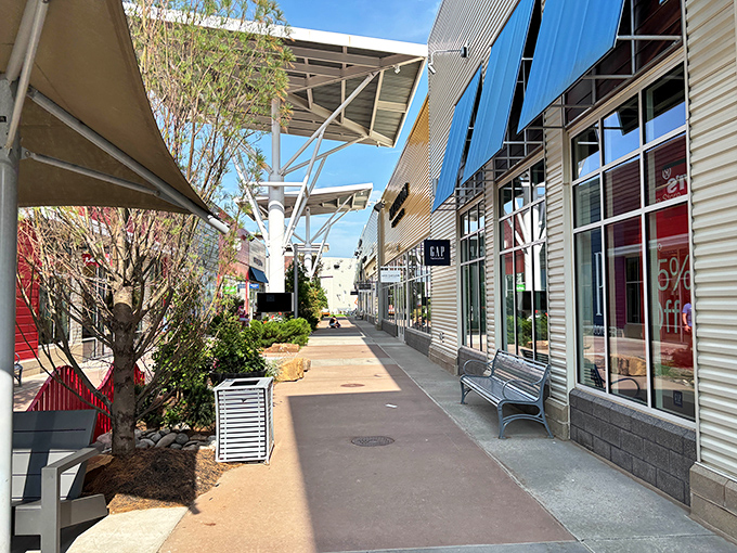Sunlight streams through the covered walkway, creating an almost gallery-like space between stores that invites leisurely exploration.