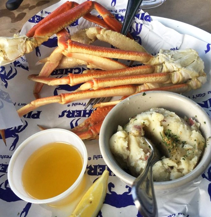 Snow crab legs arranged like nature's perfect eating utensils&mdash;crack, dip, savor, repeat. The seafood equivalent of potato chips; you can't stop at just one.