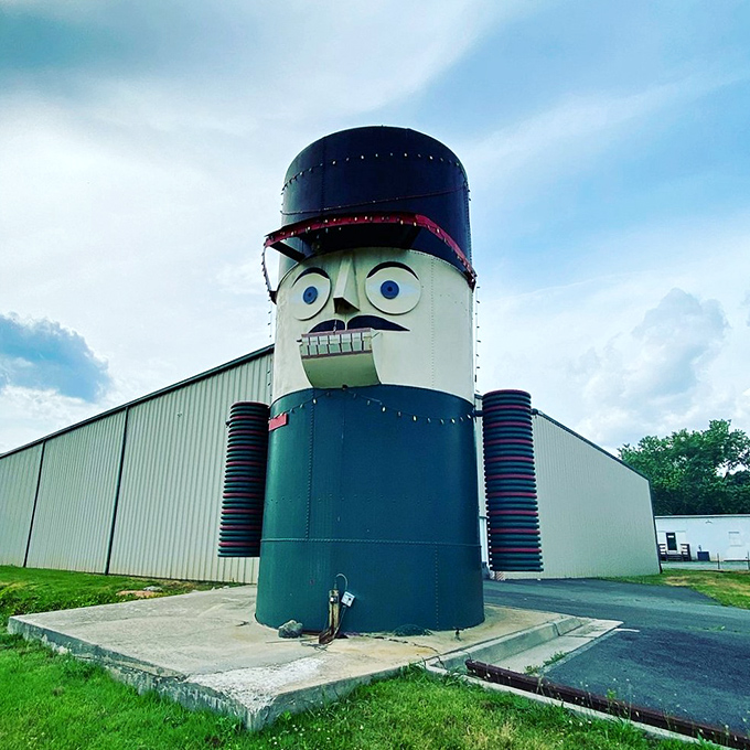 Against cloudy skies, the nutcracker's vibrant colors pop even more dramatically, like a Wes Anderson character come to life.