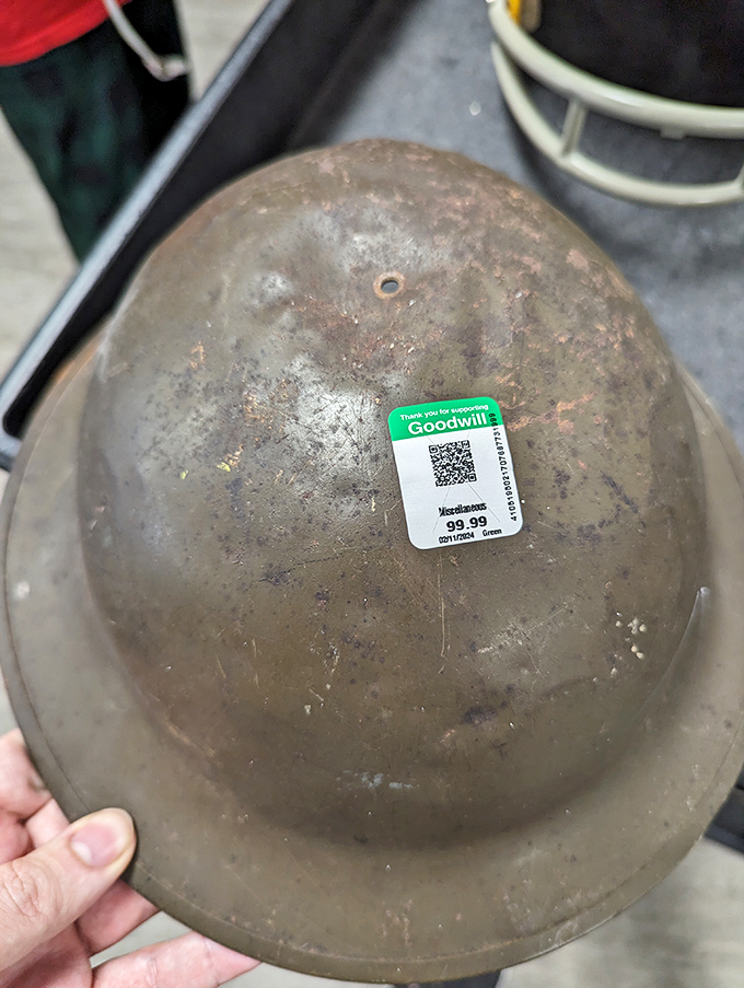 This vintage military helmet with its $99.99 price tag reminds us that history itself sometimes ends up on these shelves.