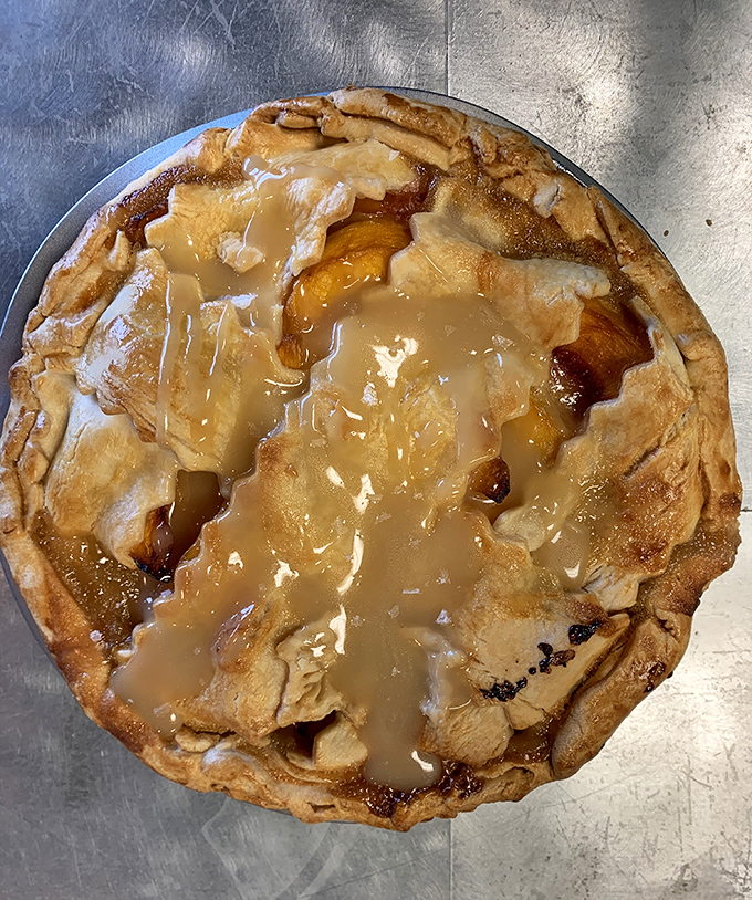 This apple pie isn't just dessert – it's autumn in Idaho captured under a golden crust and drizzled with caramel abandon.