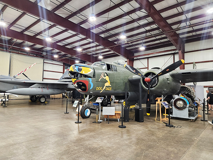 The "Doc's Doozie" B-25 Mitchell bomber, painted with personality and purpose. This isn't just an airplane &ndash; it's a canvas telling stories of courage and determination.