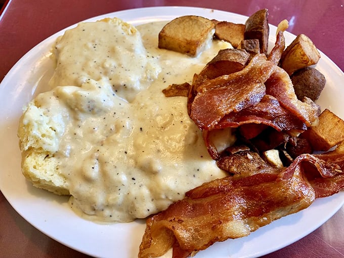 Biscuits and gravy so good they'd make a Southern grandma nod in approval, with bacon standing guard to ensure maximum breakfast satisfaction.