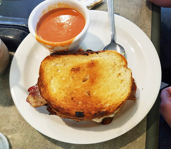 The humble grilled cheese gets the royal treatment with a side of tomato soup. Comfort food that transports you straight back to childhood, only better.
