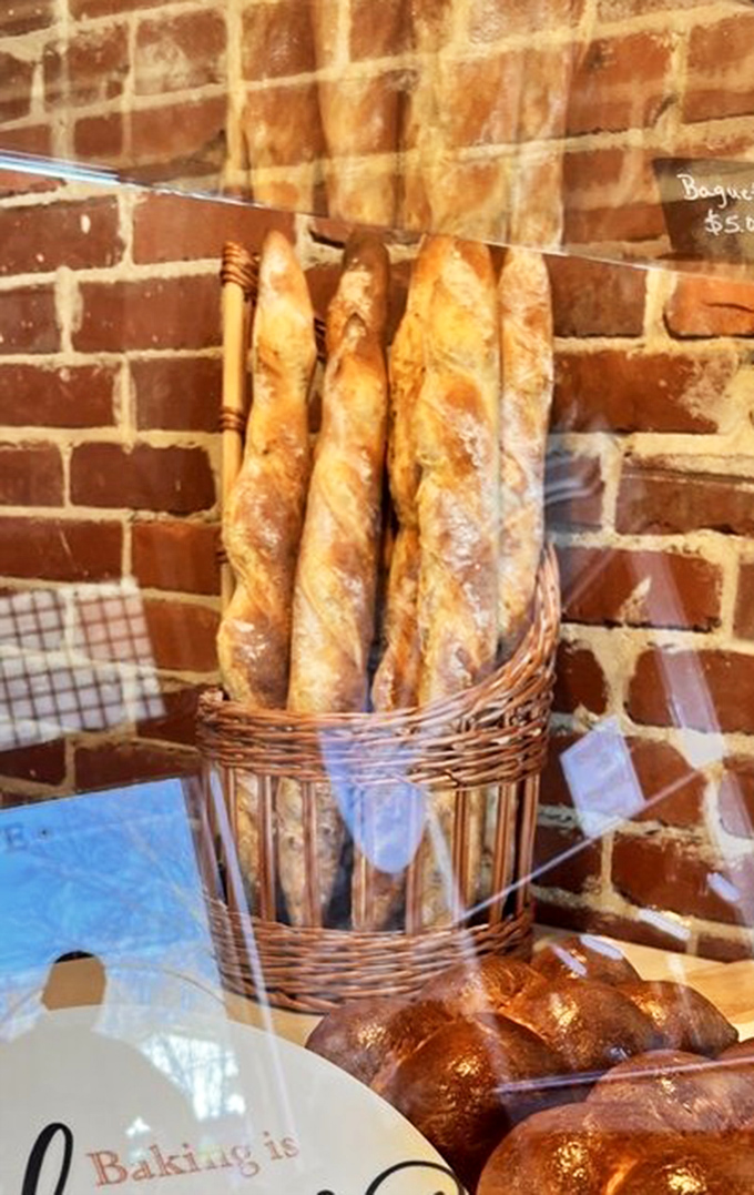 Baguettes standing tall in their basket, each one a crusty monument to simplicity. The French national anthem practically plays when you tear into one.