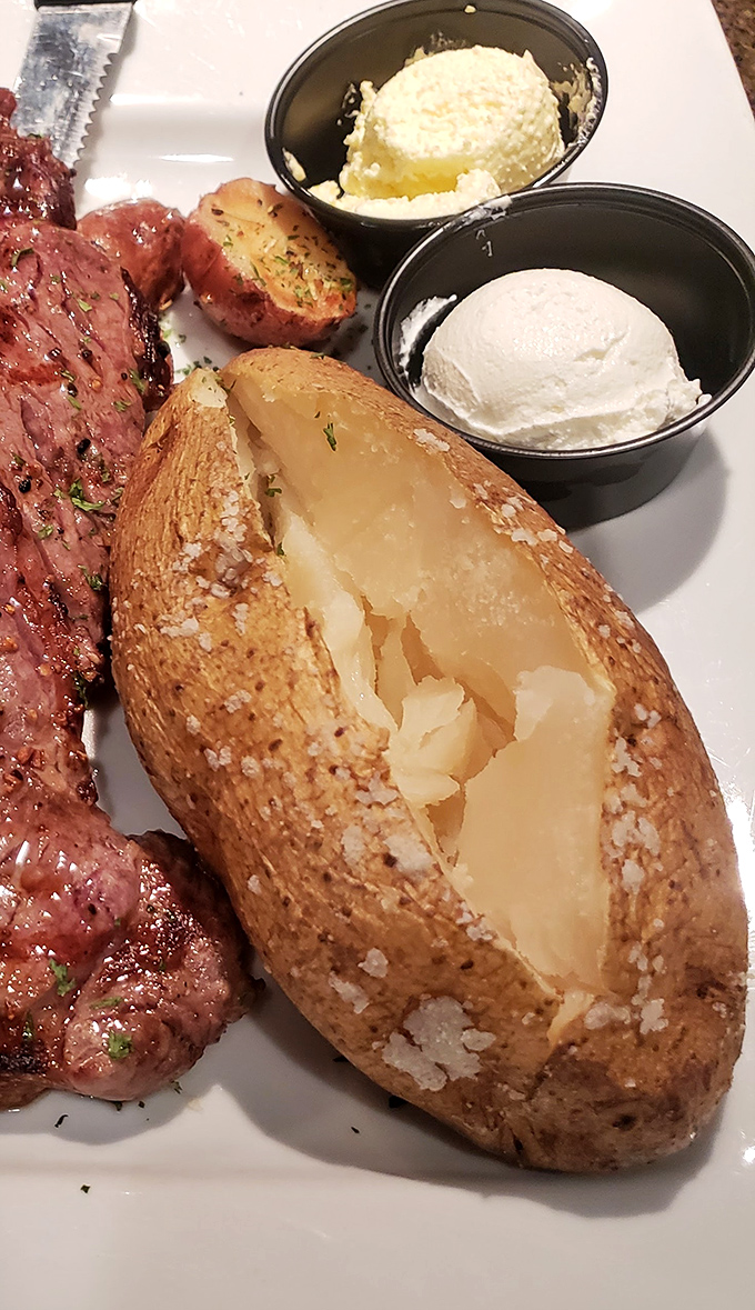 This isn't just a baked potato; it's a fluffy, salt-crusted vessel waiting to be slathered with butter and sour cream. Carb heaven exists in Mansfield.