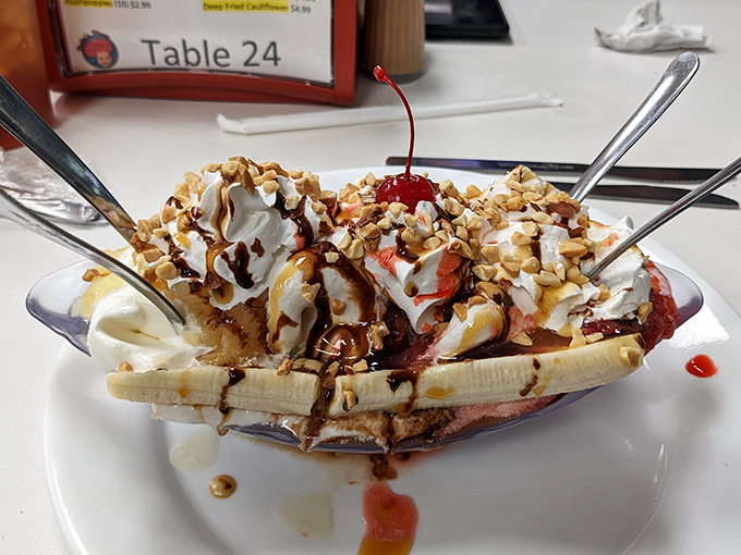 Banana splits at Dolly's aren't just desserts, they're childhood memories served in a boat with whipped cream sails and a cherry mast.