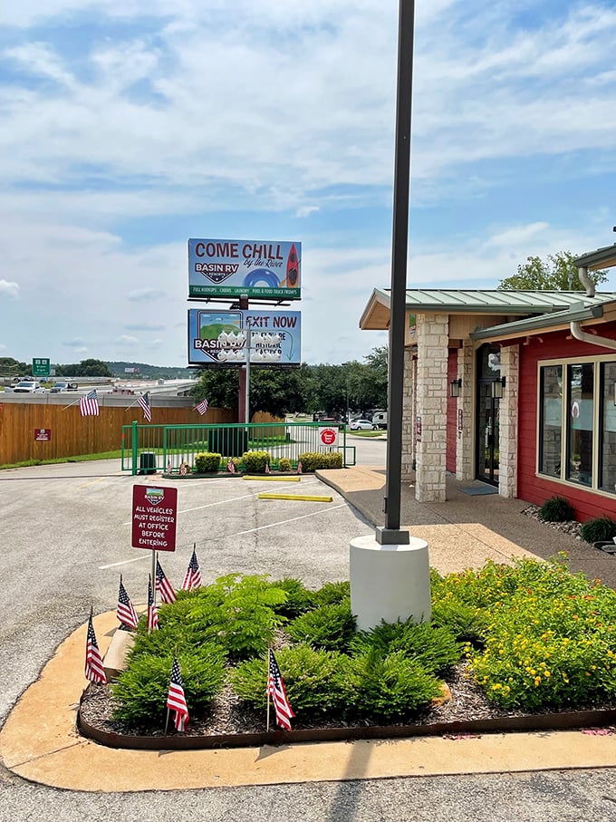 Basin RV Resort welcomes visitors with patriotic flair, offering an affordable base camp for exploring Bastrop without committing to real estate prices just yet.