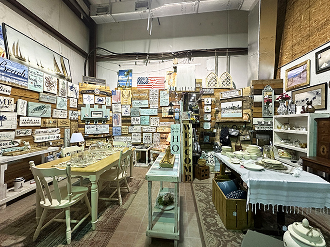 Beach-themed signs and coastal d&eacute;cor meet rustic charm in this corner that screams "summer vacation, circa 1985" in all the best ways.