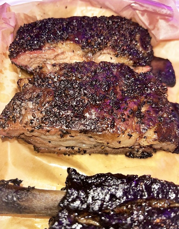 Beef ribs with a pepper crust so perfect it deserves its own Instagram. This isn't just meat; it's a masterclass in patience, smoke, and primal satisfaction.