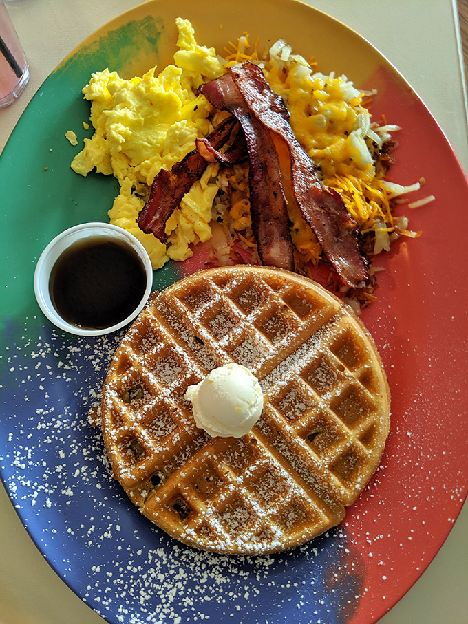 Breakfast indecision solved: a golden waffle with all the fixings. The powdered sugar dusting is like fresh snow on a delicious breakfast mountain.