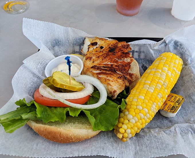 Blackened grouper sandwich with corn on the cob&mdash;proof that sometimes the simplest pleasures deliver the most profound satisfaction.