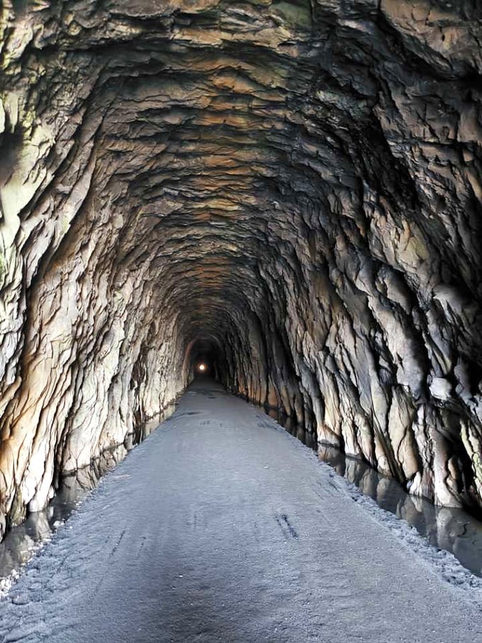 The Blue Ridge Tunnel transforms a mountain hike into a journey through time and solid rock.