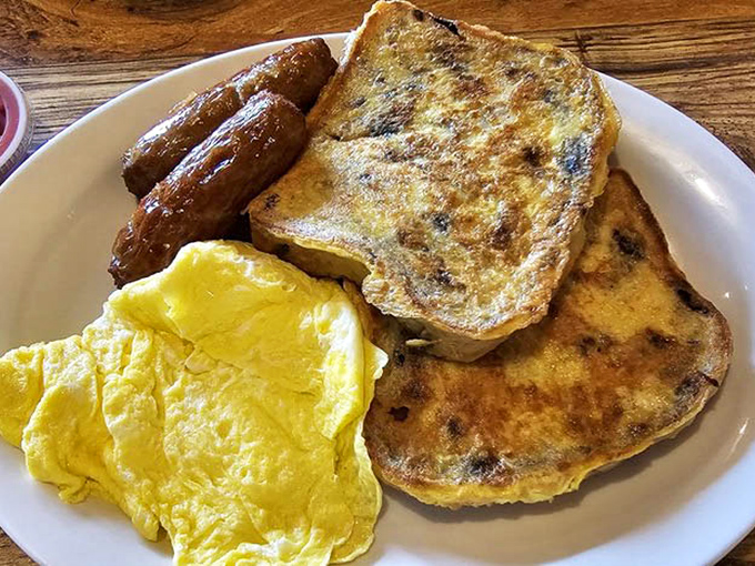 French toast that's had a blueberry epiphany, accompanied by eggs so perfectly scrambled they deserve their own cooking show.