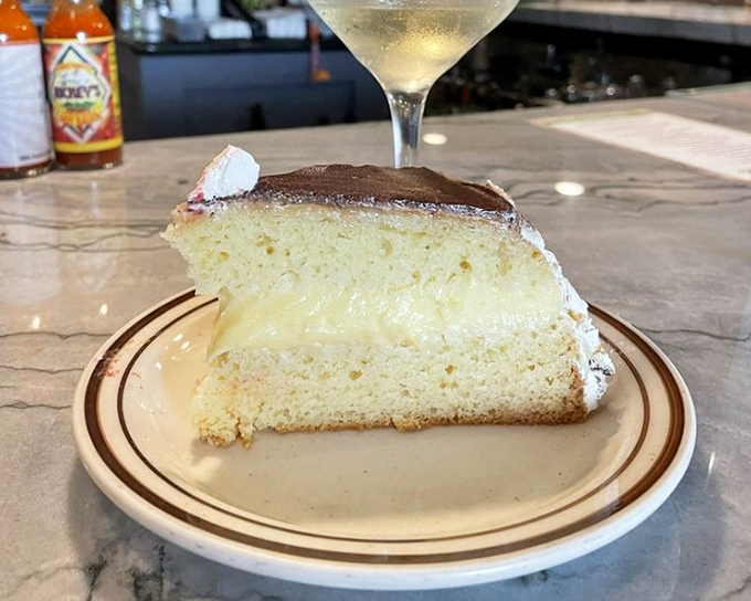 Boston cream pie that would make Paul Revere ride through town shouting about dessert instead. Creamy, dreamy, and worth every calorie.