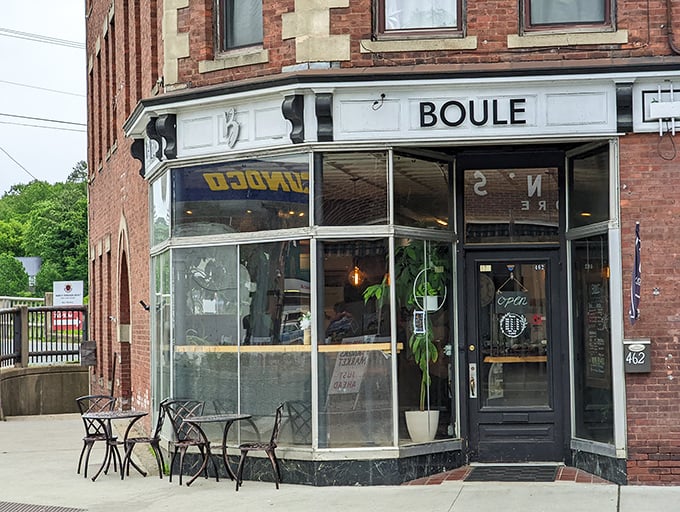 Boule's corner storefront gleams with possibility, its glass windows offering glimpses into a world where conversation flows as freely as coffee.