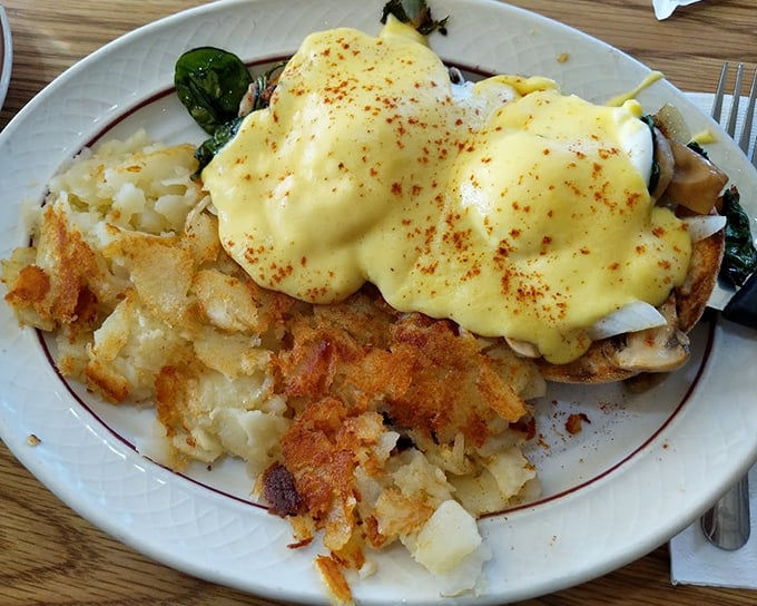 Eggs Benedict with a blanket of hollandaise so perfect it deserves its own zip code.