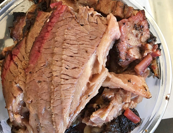 Brisket with a smoke ring so perfect, it could win a beauty pageant. The meat-to-fat ratio here is what mathematicians call "the golden ratio."