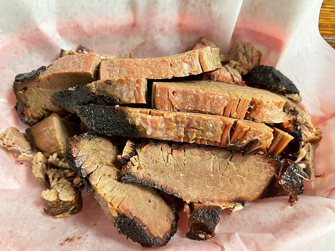 Brisket with bark so beautiful it belongs in a museum. Each slice tells the story of patience, smoke, and a pitmaster who understands the meaning of "low and slow."
