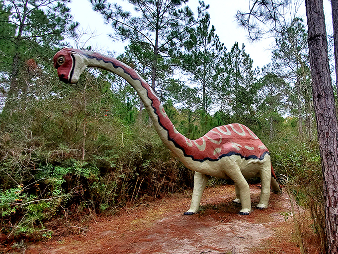 "And I shall call him&hellip; tiny head!" This visitor demonstrates the proper technique for dinosaur wrangling&mdash;equal parts bravado and theatrical posing.