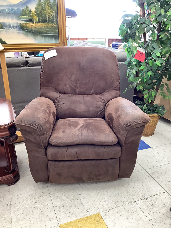 This comfy brown recliner isn't just furniture&mdash;it's someone's future nap headquarters, book nook, and TV-watching command center.
