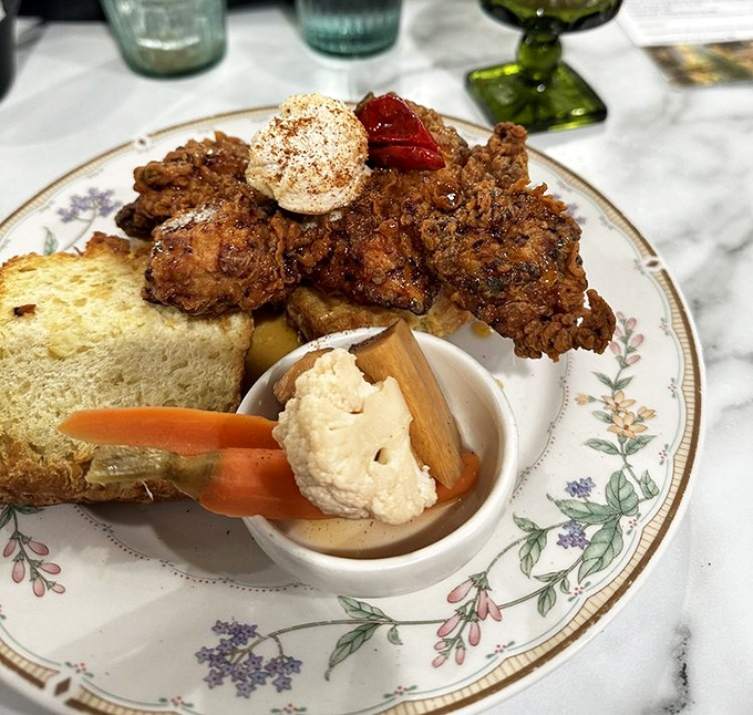 Comfort food elevated to an art form &ndash; crispy chicken perched atop bread with a side of something creamy that's calling your name.