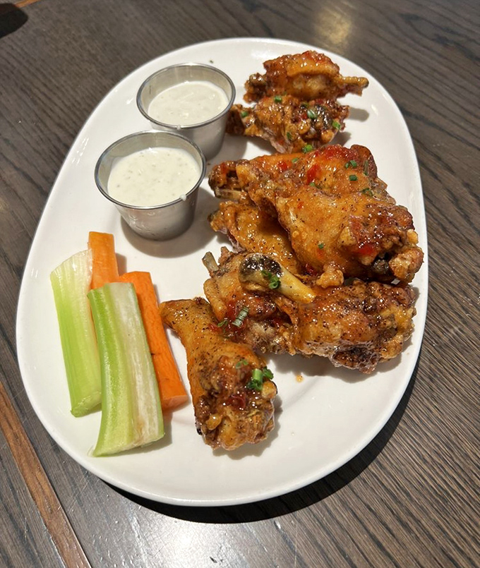 Buffalo wings that demand respect&mdash;glistening with sauce, perfectly crisp, accompanied by cooling dips and the obligatory celery that nobody actually eats.