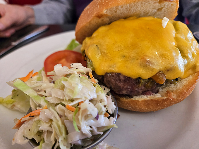 This isn't just a green chile cheeseburger; it's New Mexico's edible ambassador, wearing its melted cheese crown with well-deserved pride.