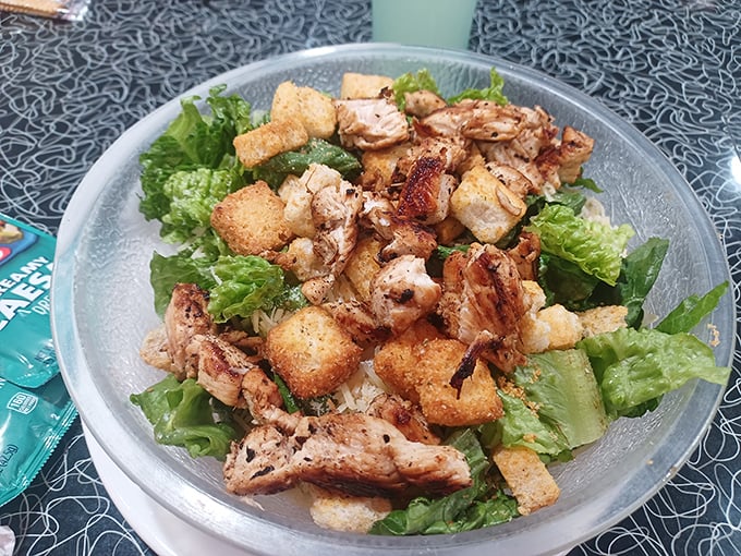 A vibrant classic: crispy greens and grilled chicken, proving a Caesar salad can be a serious, satisfying meal.