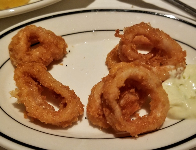Golden-fried rings of calamari, crispy perfection next to a creamy sauce. They&rsquo;re a salty, crunchy winner&mdash;just try one!