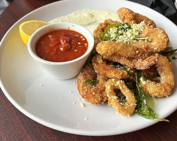 Golden-fried calamari rings and tentacles with that perfect crunch, dusted with parmesan and herbs&mdash;seafood transformed into addictive finger food.