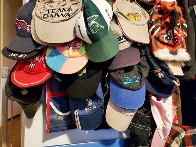 Baseball caps tell Mississippi stories through faded logos and sweat-stained brims. That Team Daiwa hat probably witnessed some legendary fishing tales!