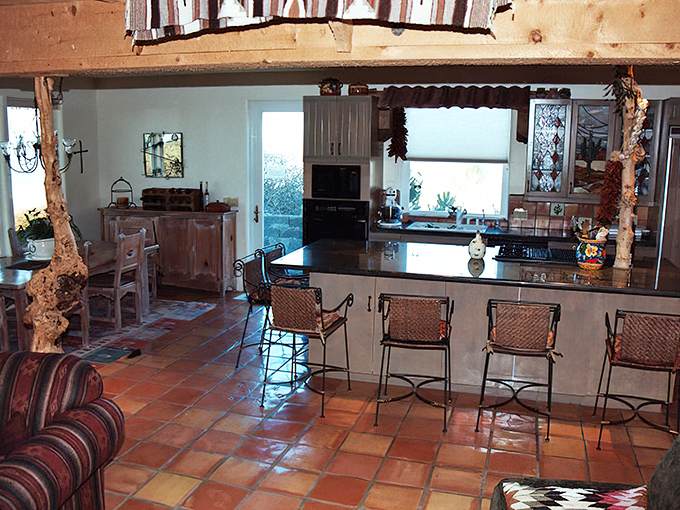 Southwestern meets Pacific Northwest in this kitchen where terra cotta tiles and driftwood accents create the perfect backdrop for seafood feasts.