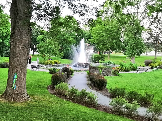 Cascade Park's fountain creates nature's symphony, surrounded by meticulously maintained gardens that bloom with Maine's stubborn determination.