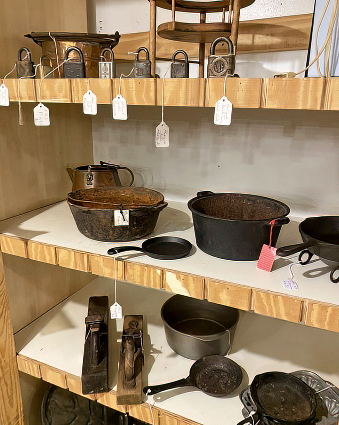 Cast iron heaven awaits seasoned collectors &ndash; these weathered pans have decades of cooking wisdom seasoned into their surfaces, just waiting for your next cornbread.